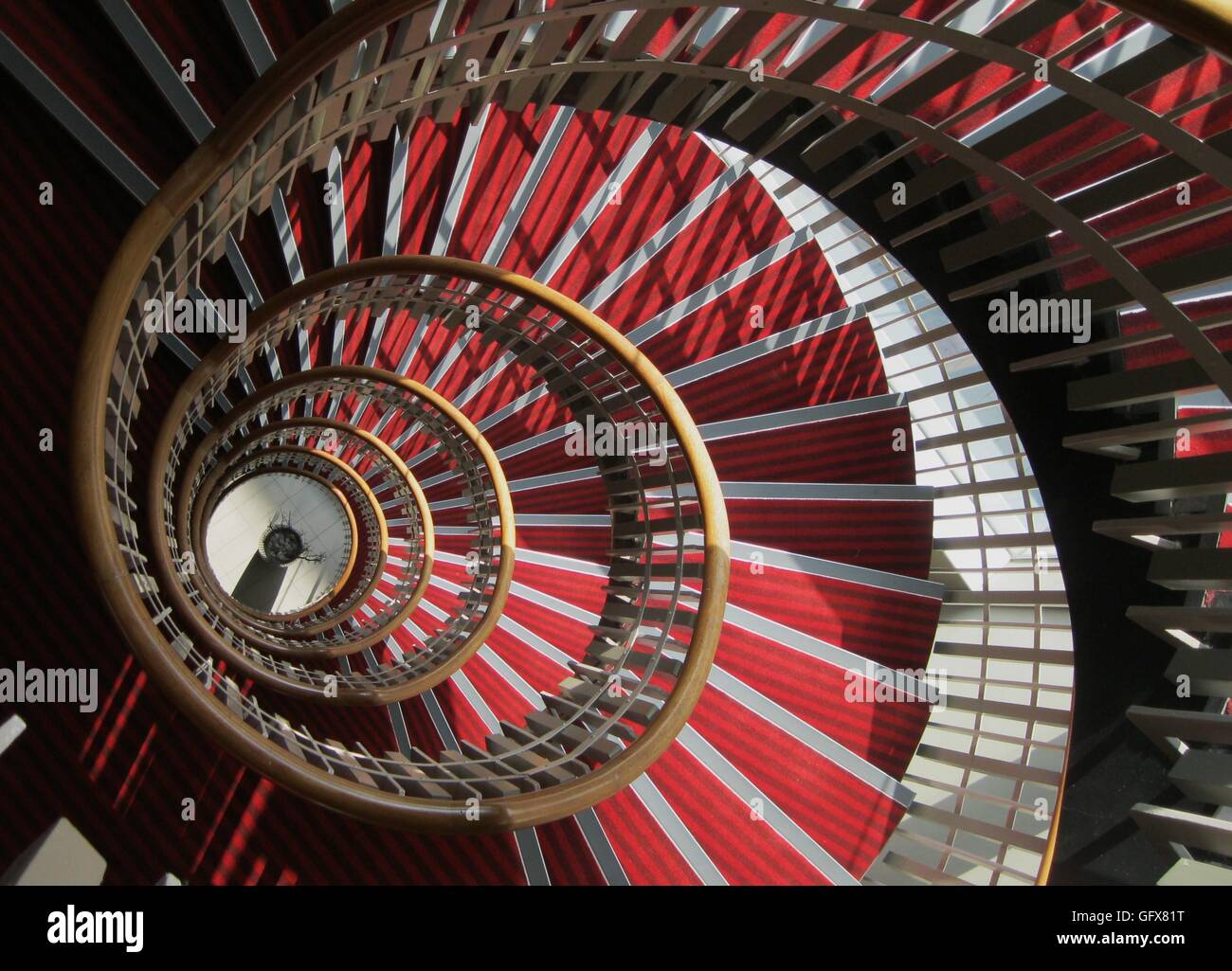 spiralling down staircase Stock Photo - Alamy