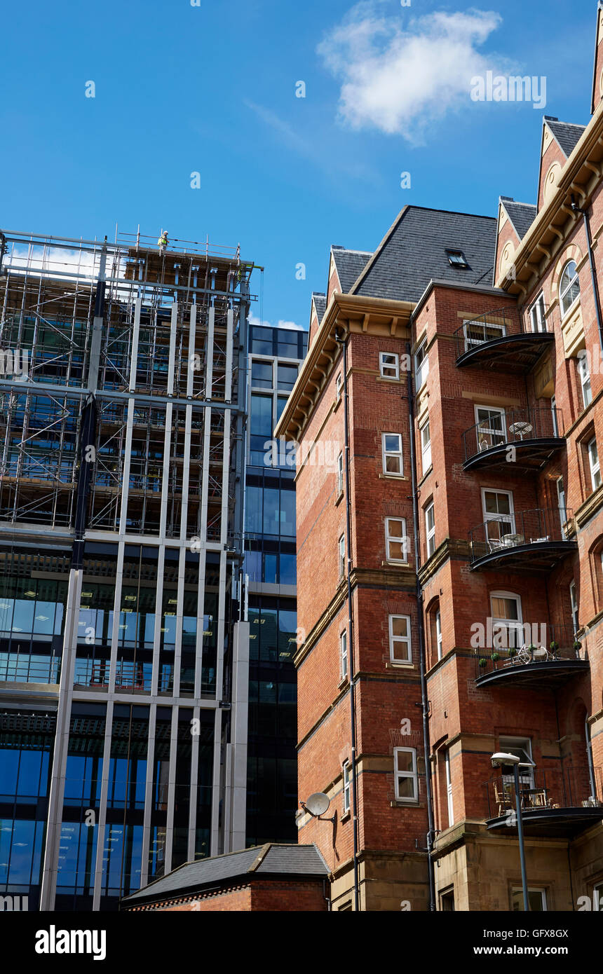 Brickwork of old building contrasted with modern building of Central ...