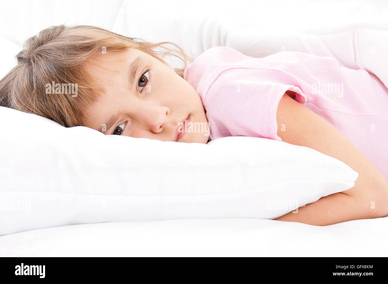 Girl awaked up in bed Stock Photo - Alamy