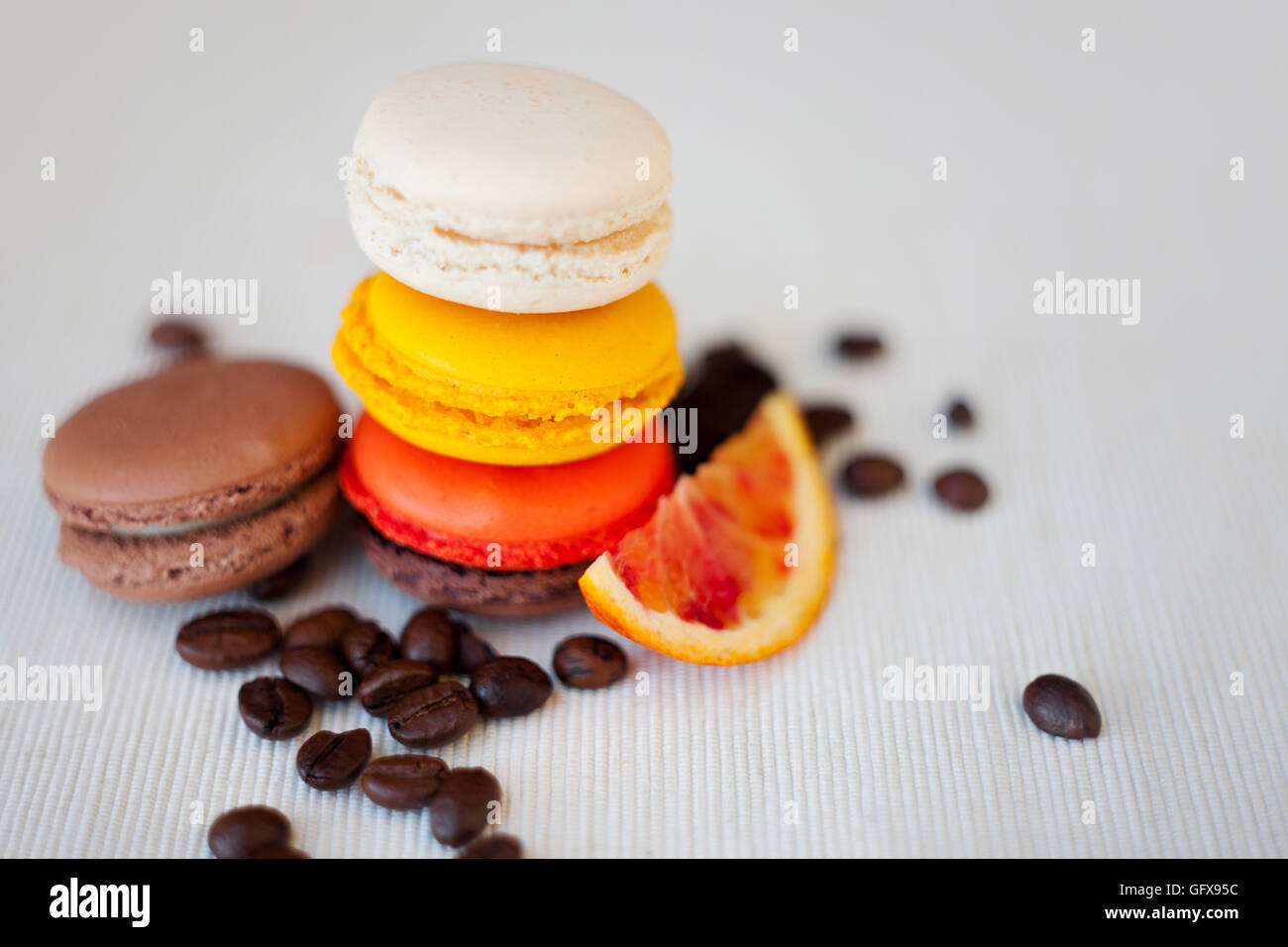 Colorful macaroons tower close-up on black background Stock Photo - Alamy