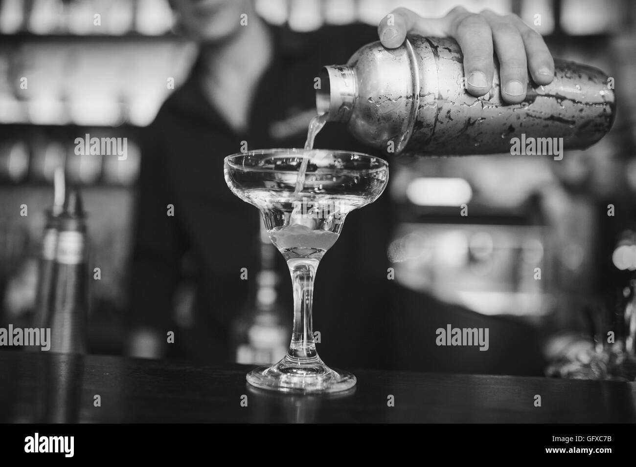 Barman at work in the pub making cocktails Stock Photo - Alamy