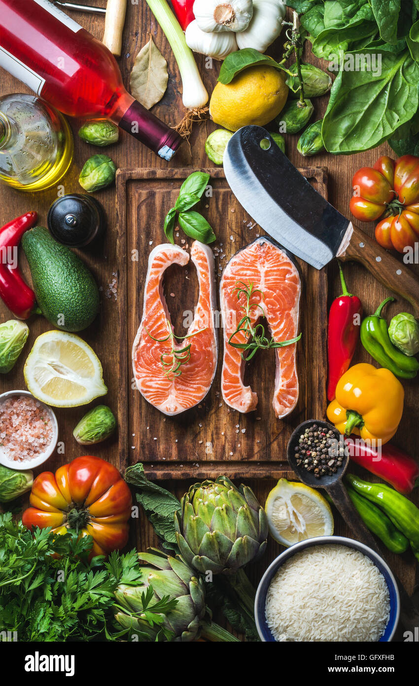 Dinner cooking ingredients. Raw uncooked salmon fish with vegetables ...