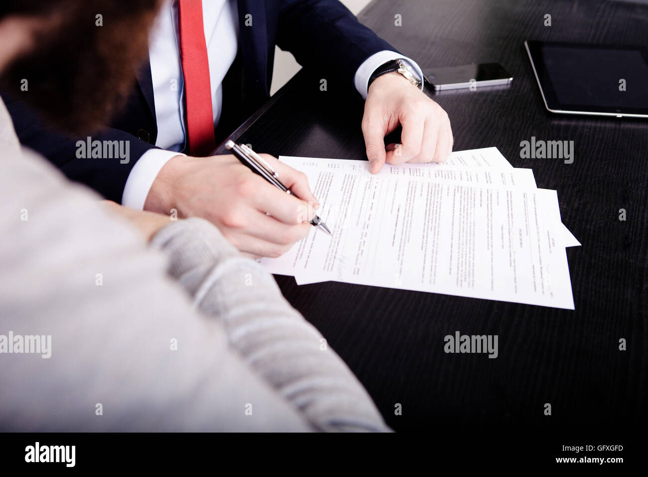 Hands signing document hi-res stock photography and images - Alamy