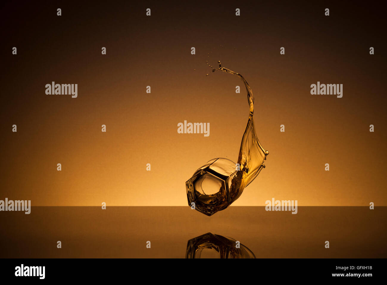 Flying glass of whiskey Stock Photo - Alamy