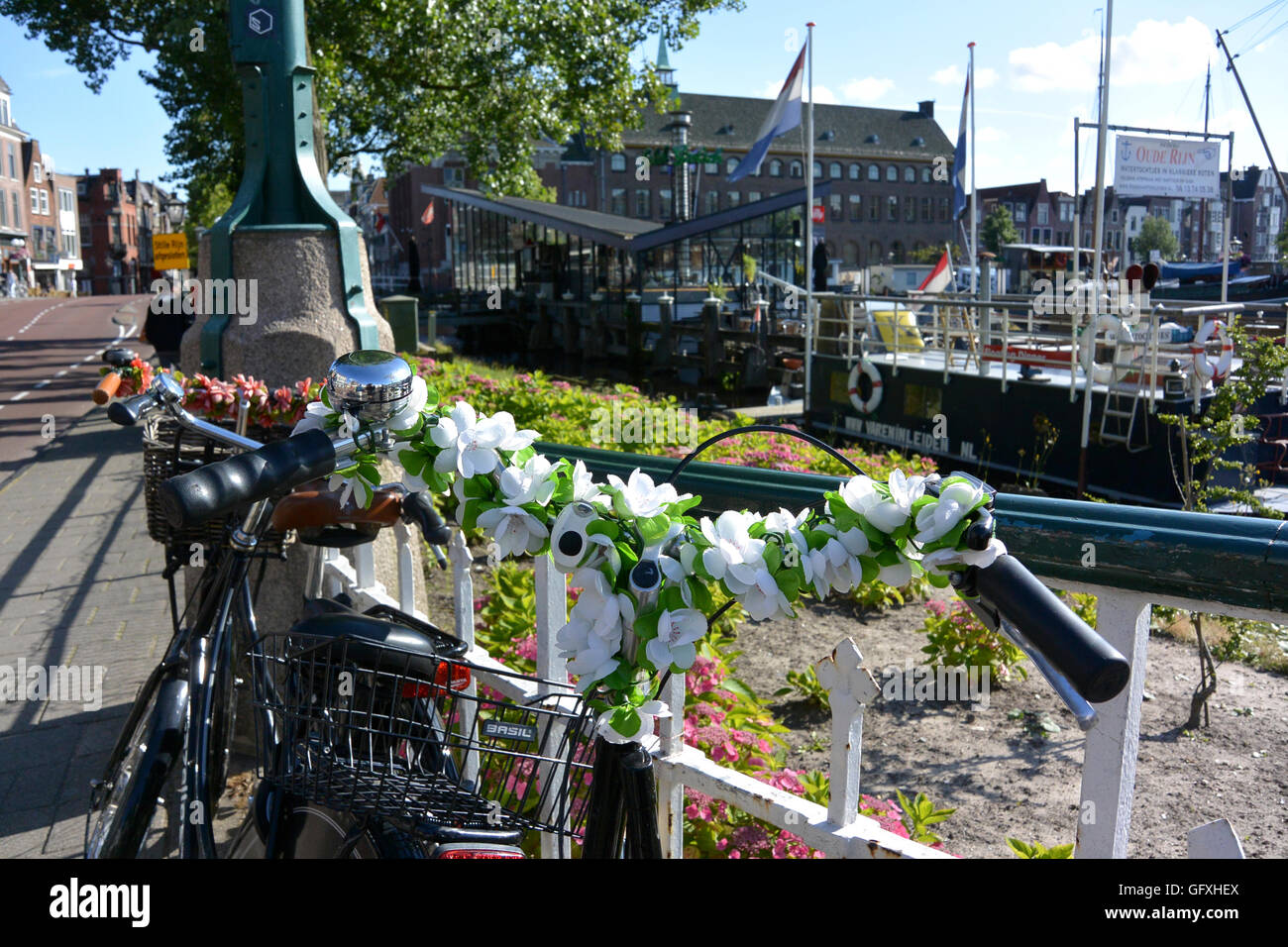 Dutch bicycle customised with flowers on the handlebar Stock Photo - Alamy