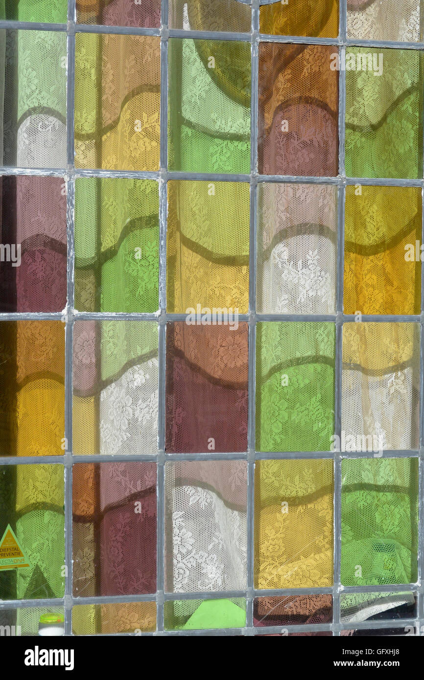 Colour panes of glass in a window Stock Photo - Alamy