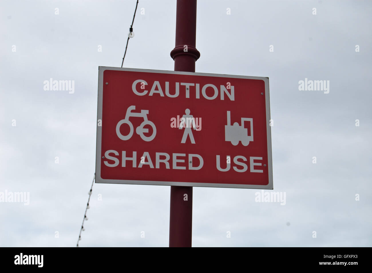 Caution Shared Use sign for bikes/people/train in St Helier, Jersey ...