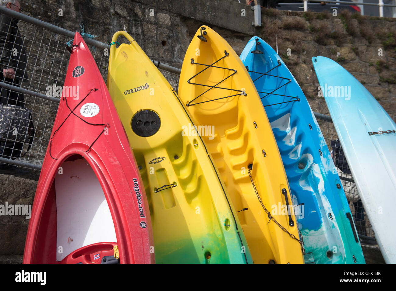 Colourful Kayaks in Mousehole harbour in Cornwall UK Stock Photo - Alamy