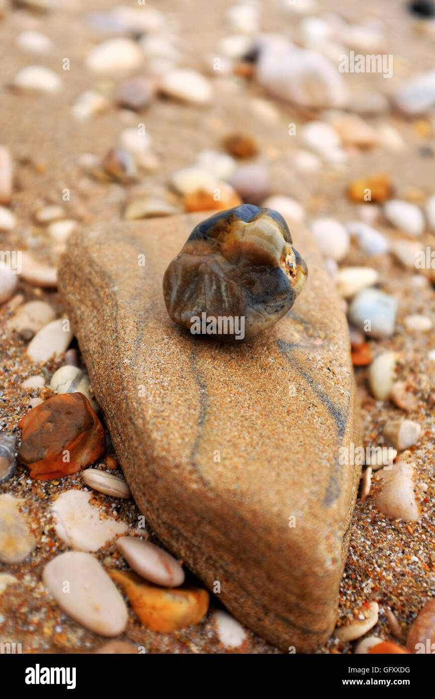 Pyramid made with wet pebble stones on the sea beach, Corfu Island ...