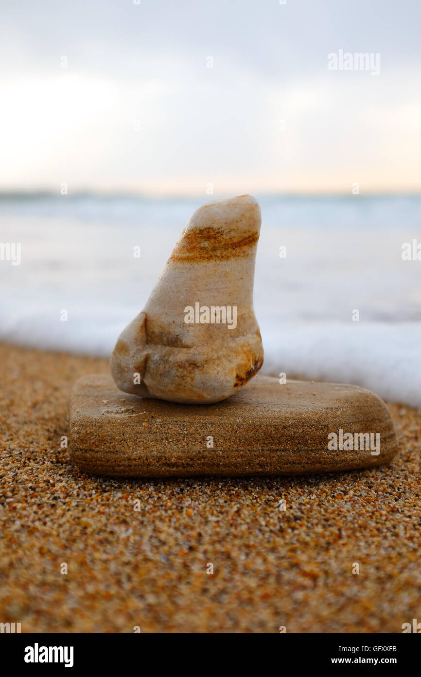 Pyramid made with wet pebble stones on the sea beach, Corfu Island ...