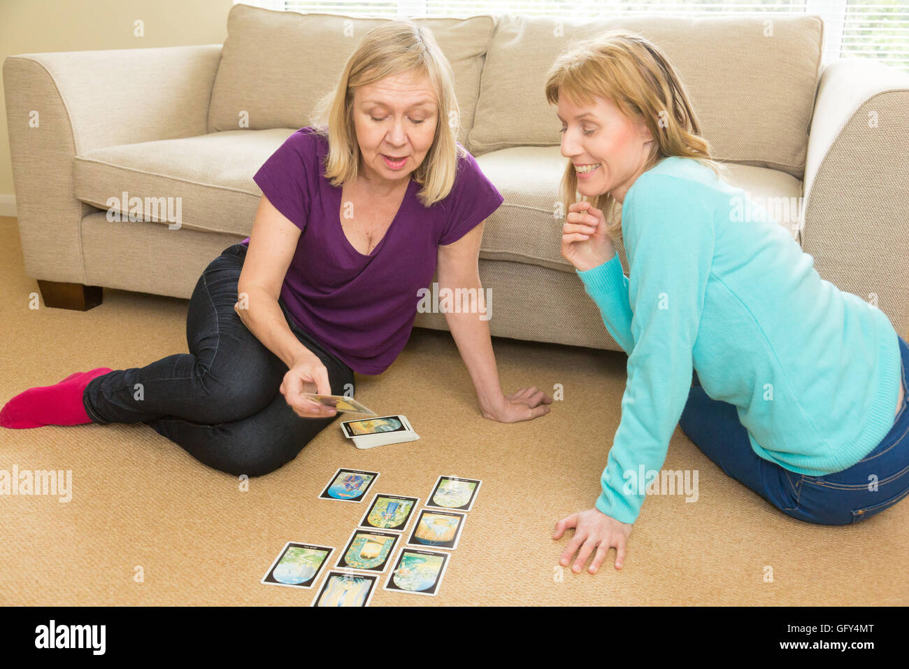 women using tarot cards Stock Photo - Alamy