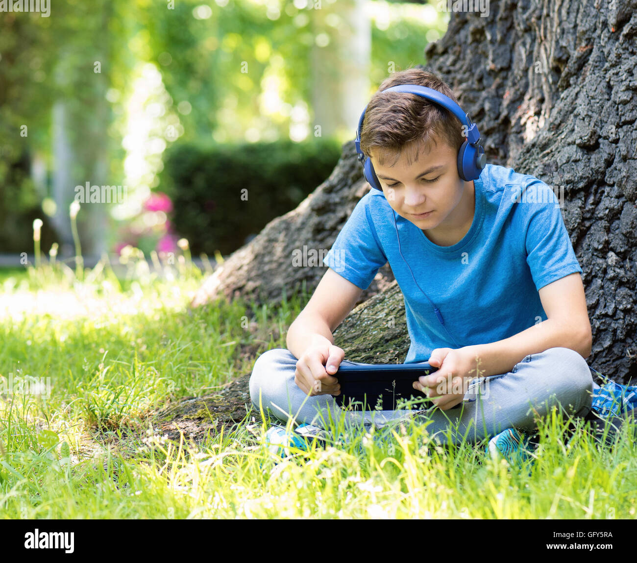 Boy with tablet Stock Photo - Alamy