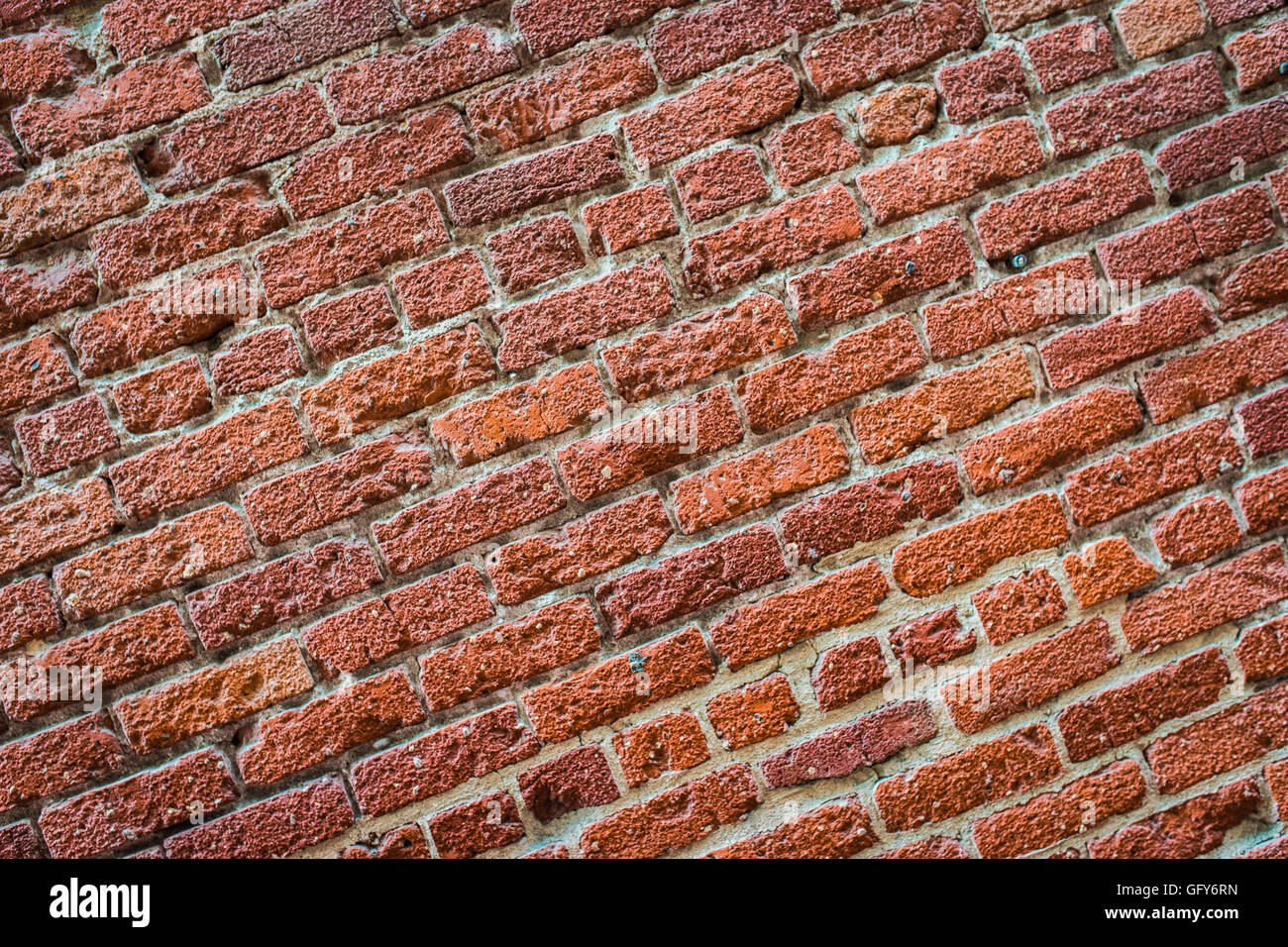 Lines of red brick masonry set on a slanted diagonal angle Stock Photo ...