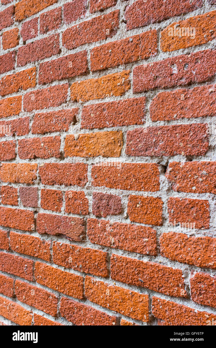 Red bricks in wall angled away from the viewer Stock Photo - Alamy