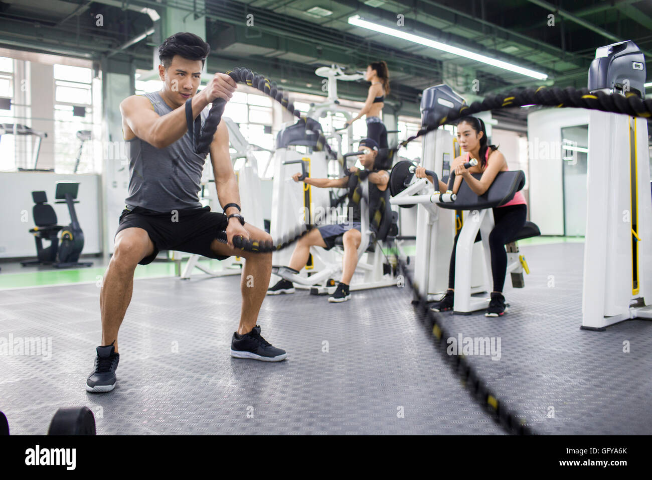 Four young men exercising hi-res stock photography and images - Alamy