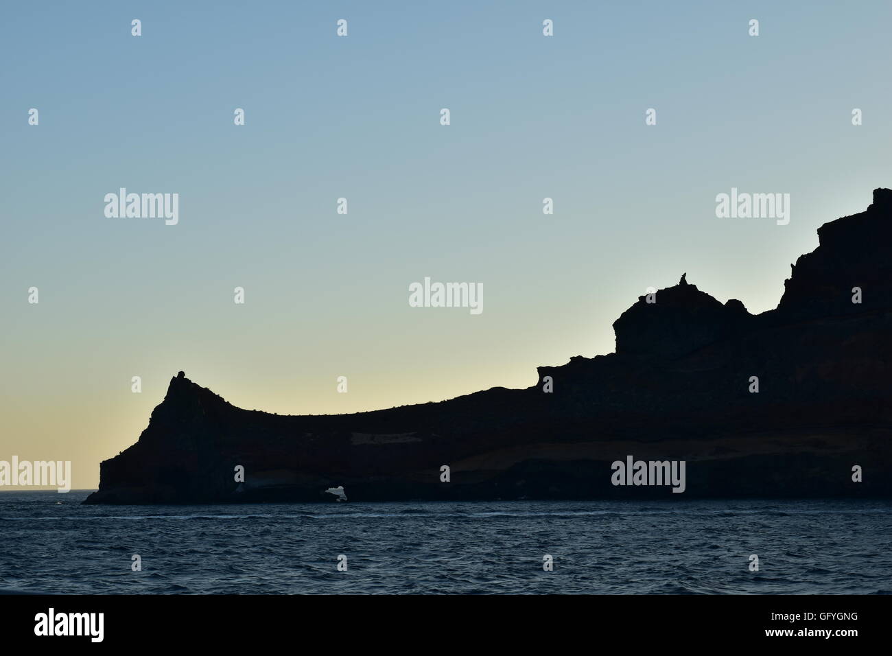 crocodile island in santorini after the sunset Stock Photo - Alamy