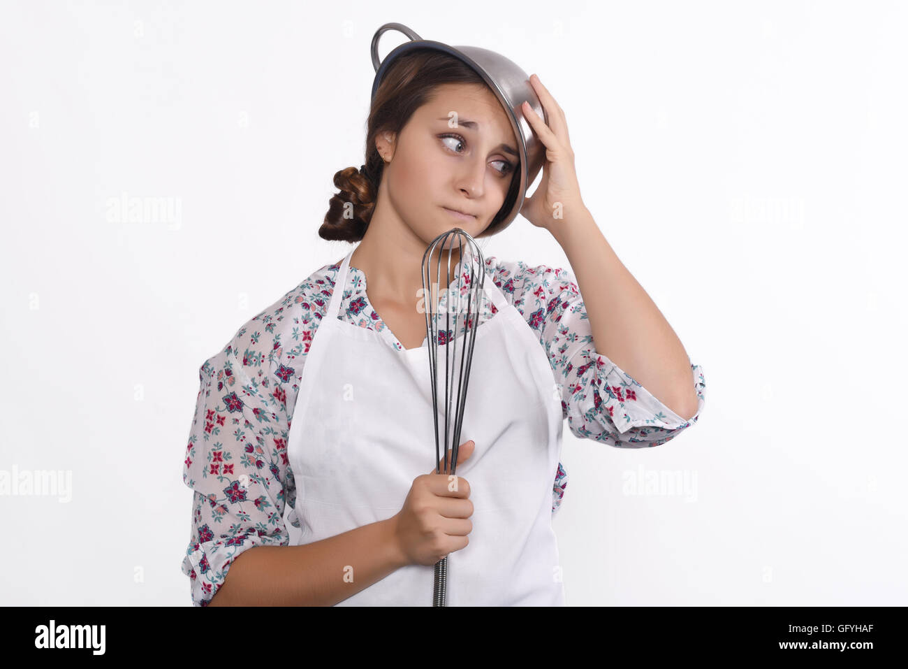 Portrait of young beautiful chef thinking. Isolated white background ...