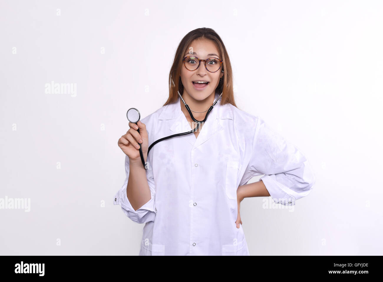 Close up of a beautiful doctor with a stethoscope. Isolated white ...