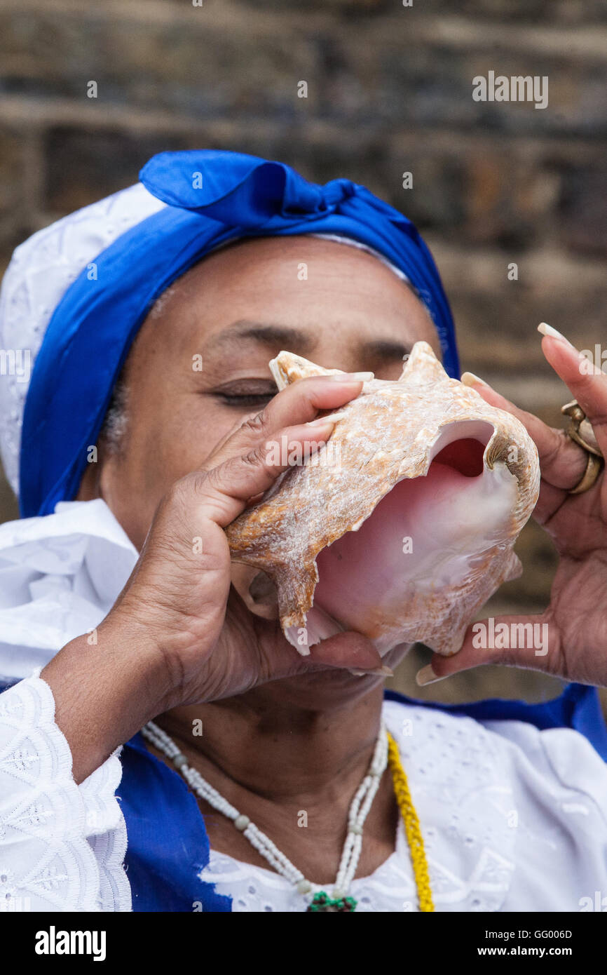 London, UK. 1st August, 2016. A woman sounds a conch shell during the ...