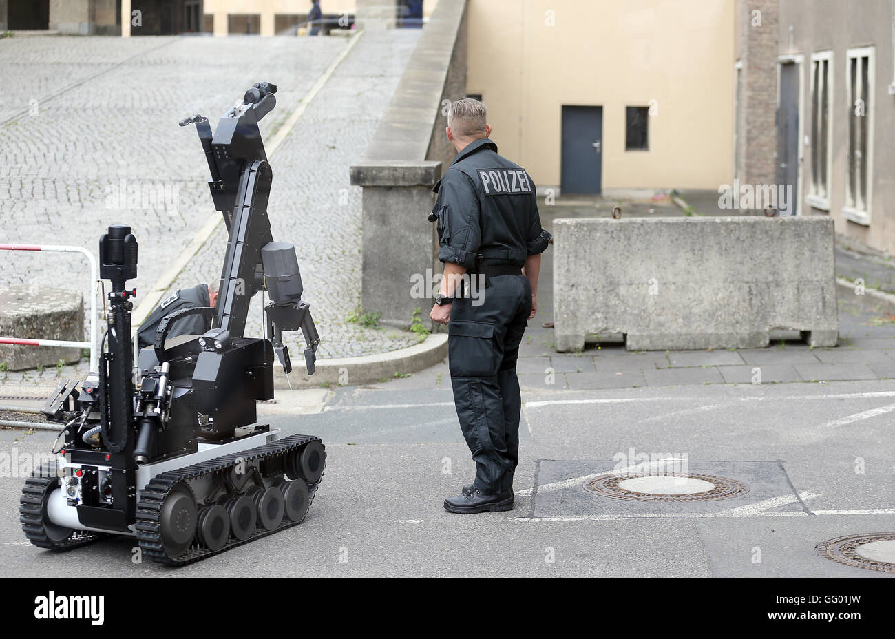 A police officer from a special unit positions a remote controlled ...