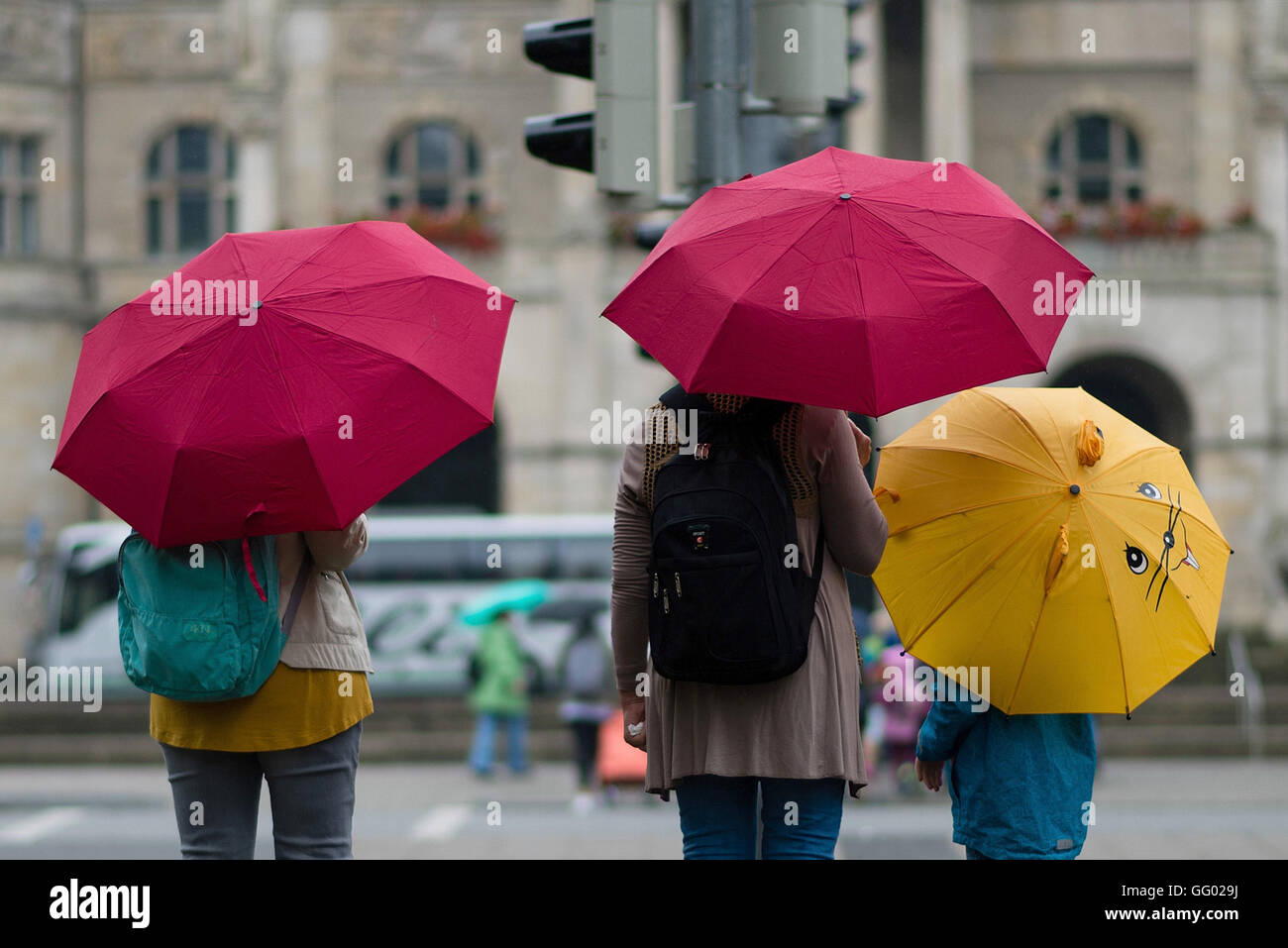 Hanover, Germany. 2nd Aug, 2016. Two women and a child wait at a ...