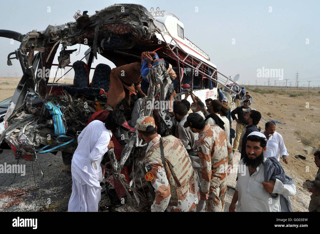 Jamshoro, Pakistan. 2nd August, 2016. Pakistani people gather beside a ...