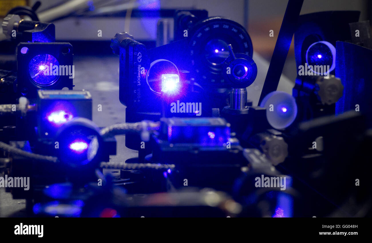 Braunschweig, Germany. 30th May, 2016. Blue laser light shines in a ...