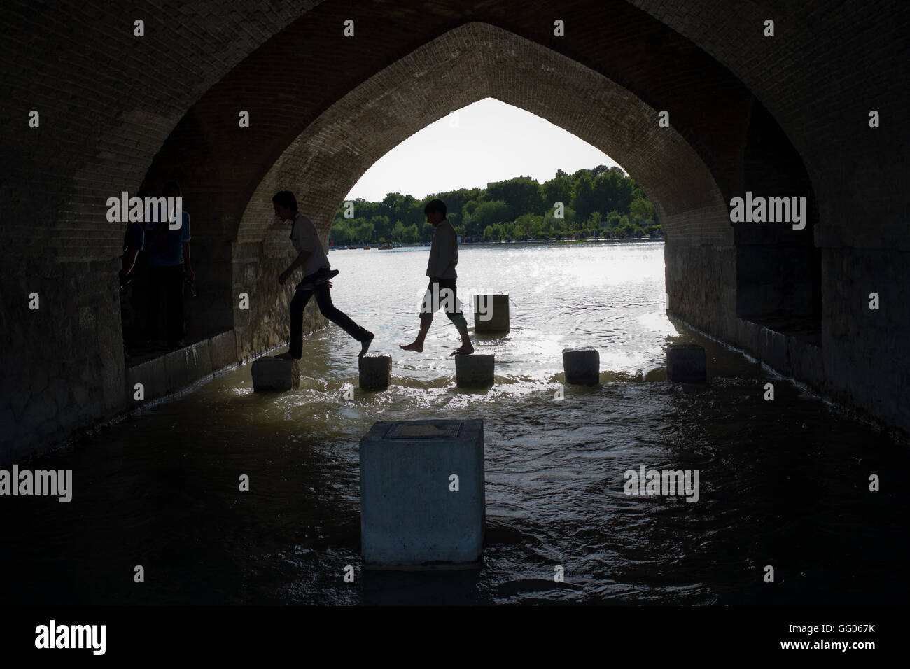 Isfahan, Iran. 24th May, 2013. File Image - Kids walk under the Si-o ...