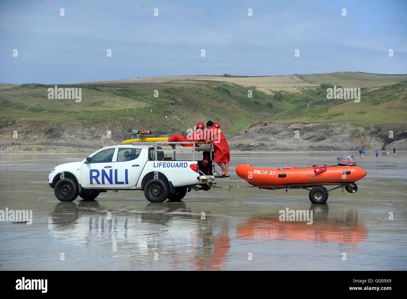 Beach lifeguard, RNLI lifeguards, Polzeath beach, Cornwall, UK Stock ...