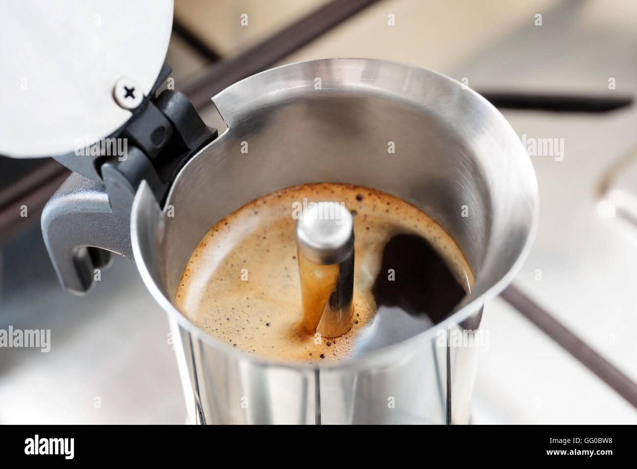 Espresso made at home, with steel mocha. coffee foam rises to the ...