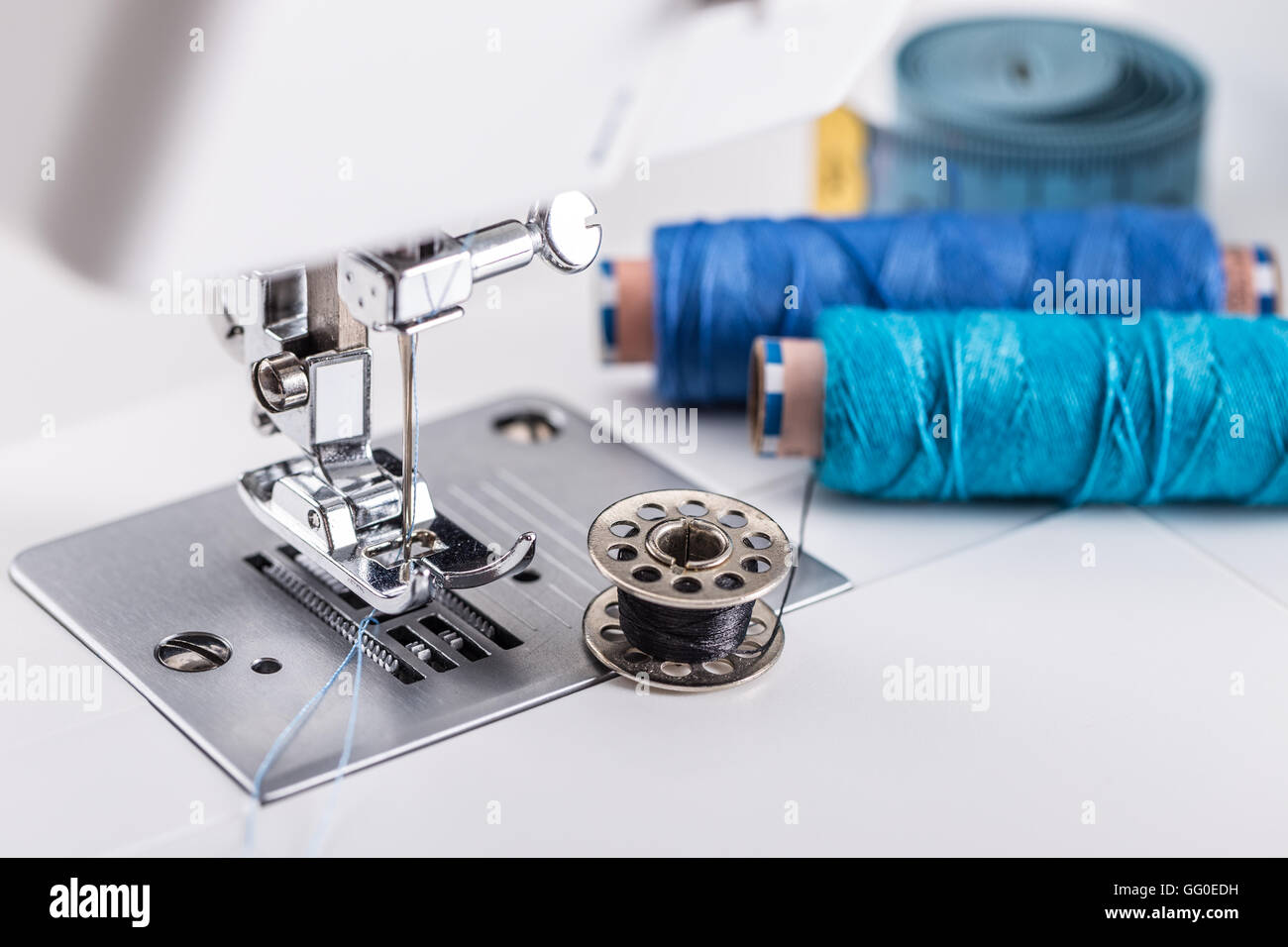 Detail of sewing machine with threads and bobbins Stock Photo - Alamy