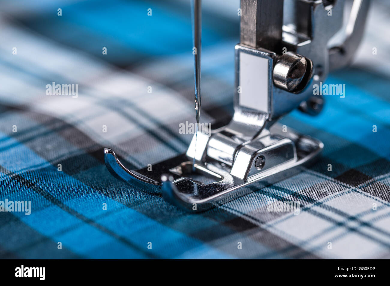 Close-up of sewing machine and fabric Stock Photo - Alamy