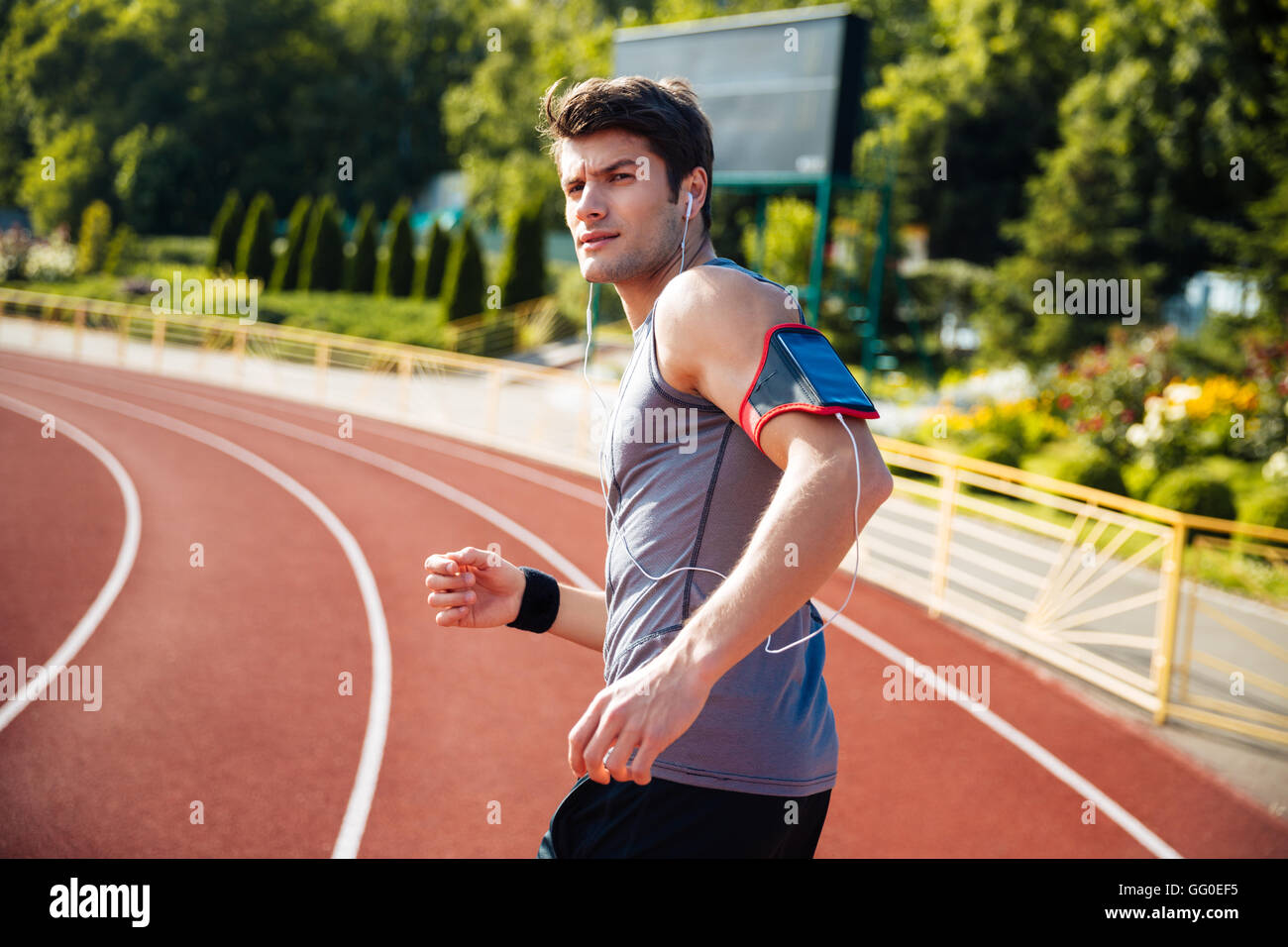 Person with mobile phone sports stadium hi-res stock photography and ...