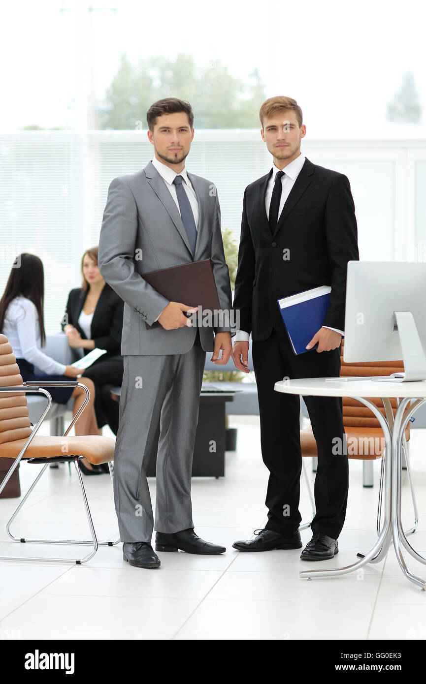 Two successful business people looking confident Stock Photo - Alamy