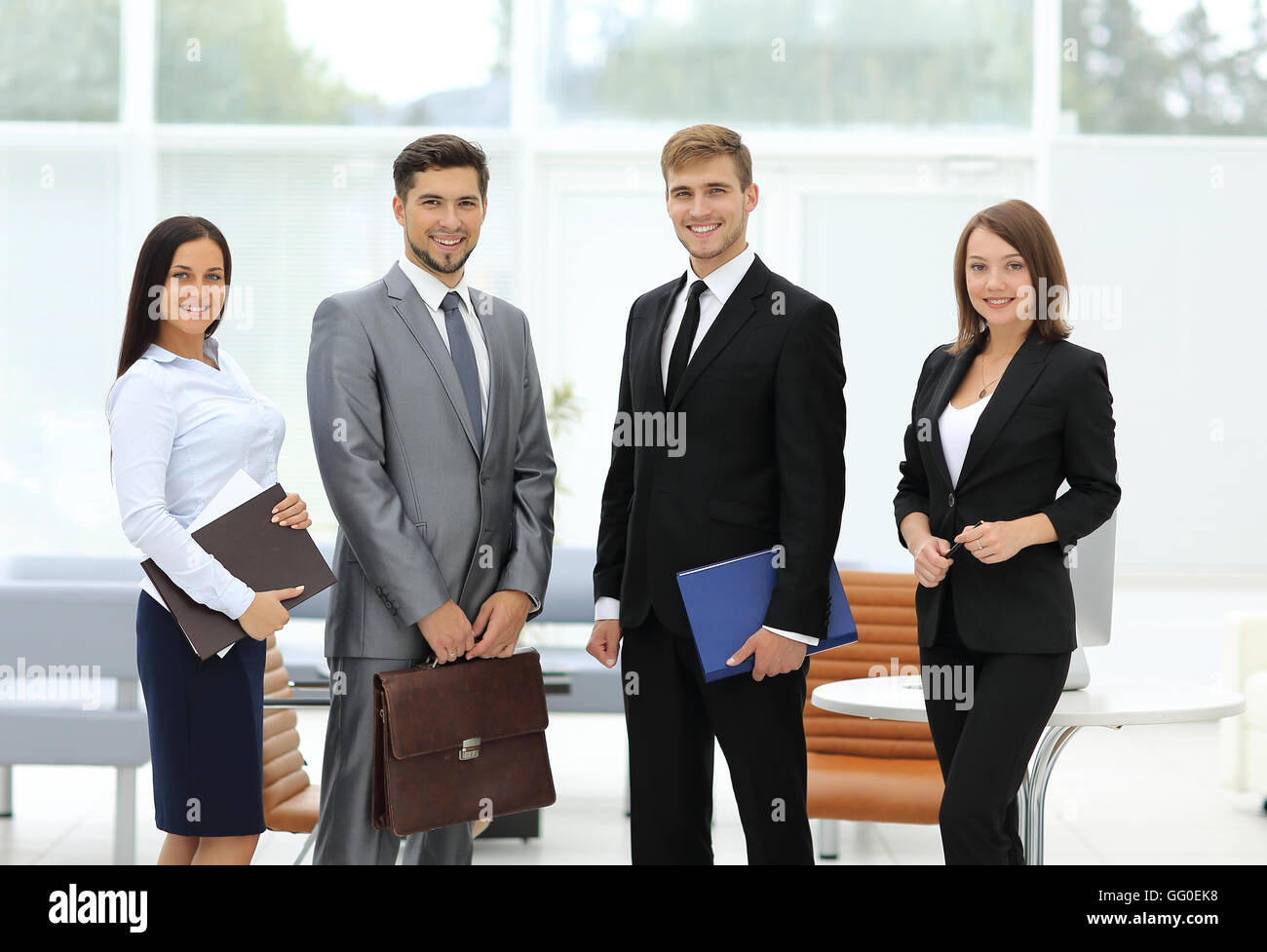 Successful business people looking happy and confident Stock Photo - Alamy