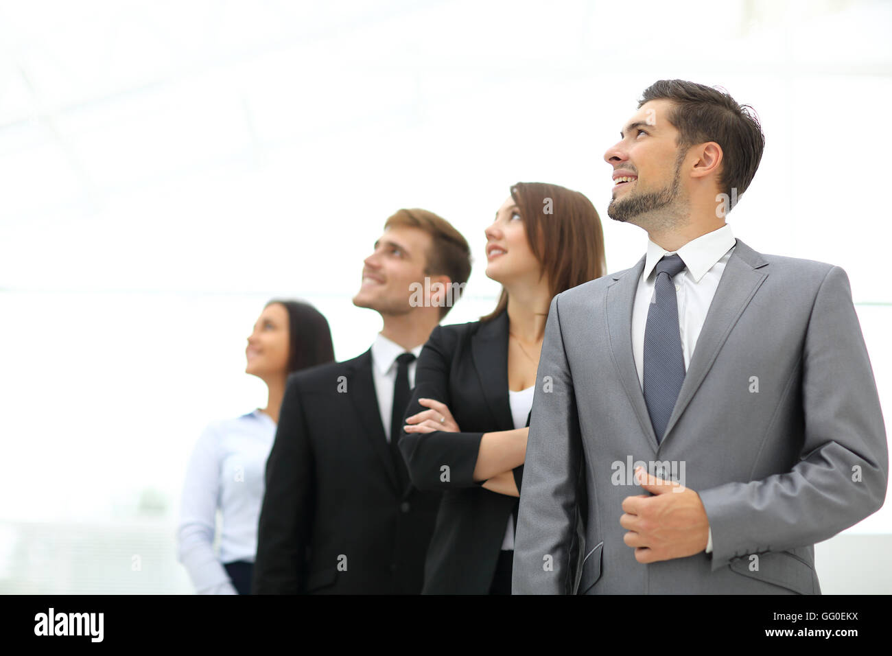 Smiling employee's in a line at work Stock Photo - Alamy