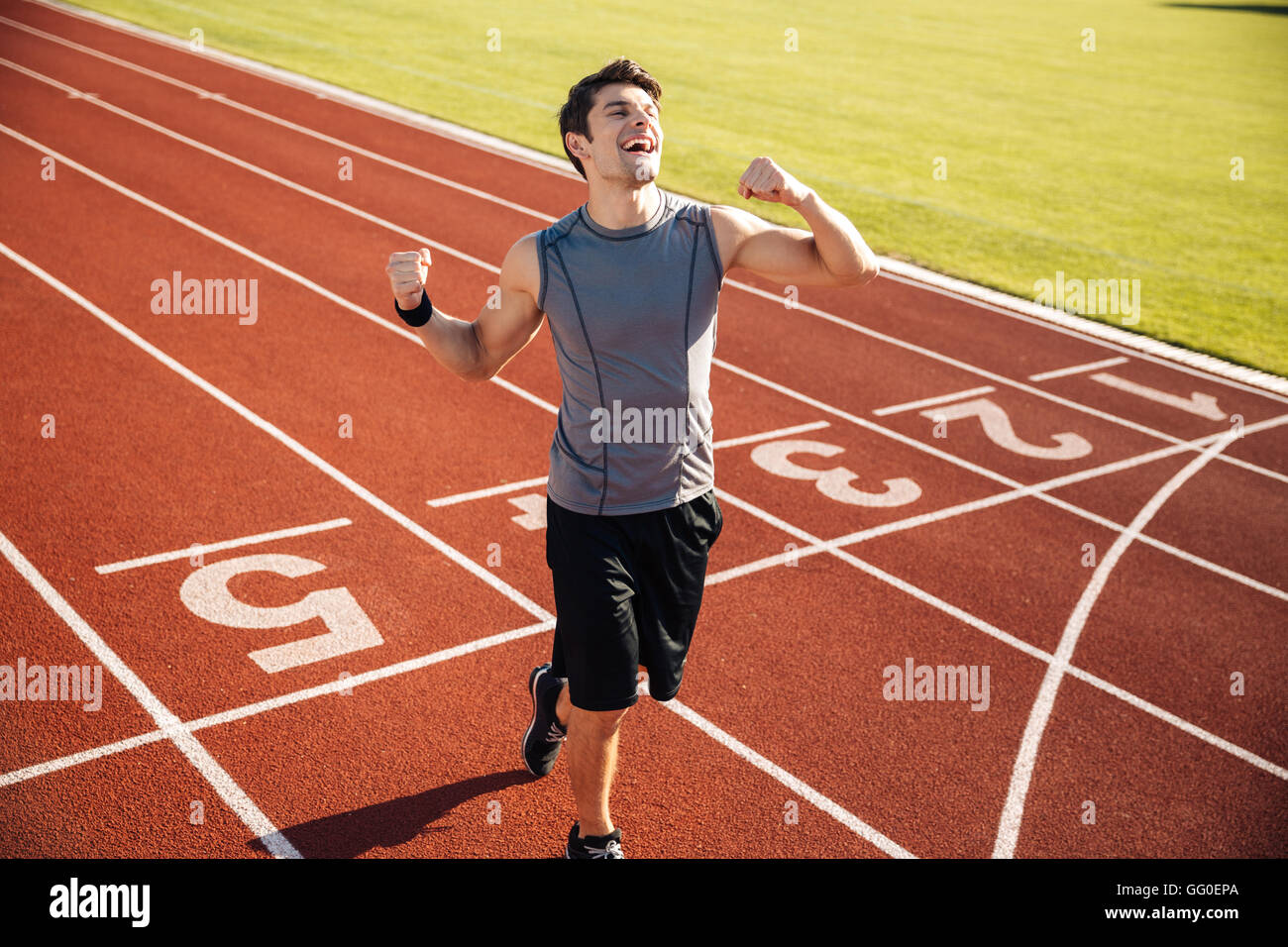 Running celebrating runner hi-res stock photography and images - Alamy