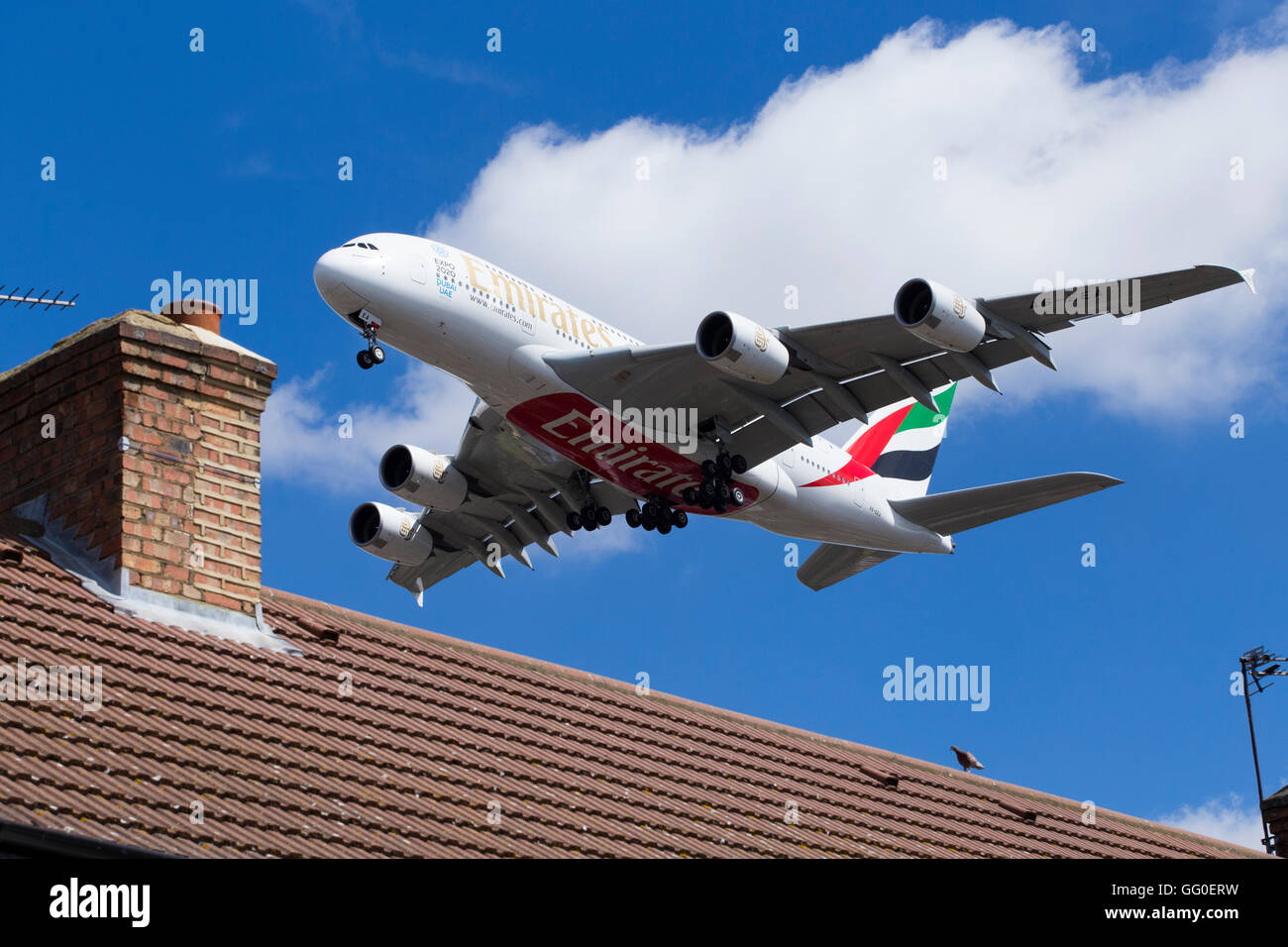 Emirates Airbus / Air Bus A380-861 A6-EEA plane landing over roof tops ...