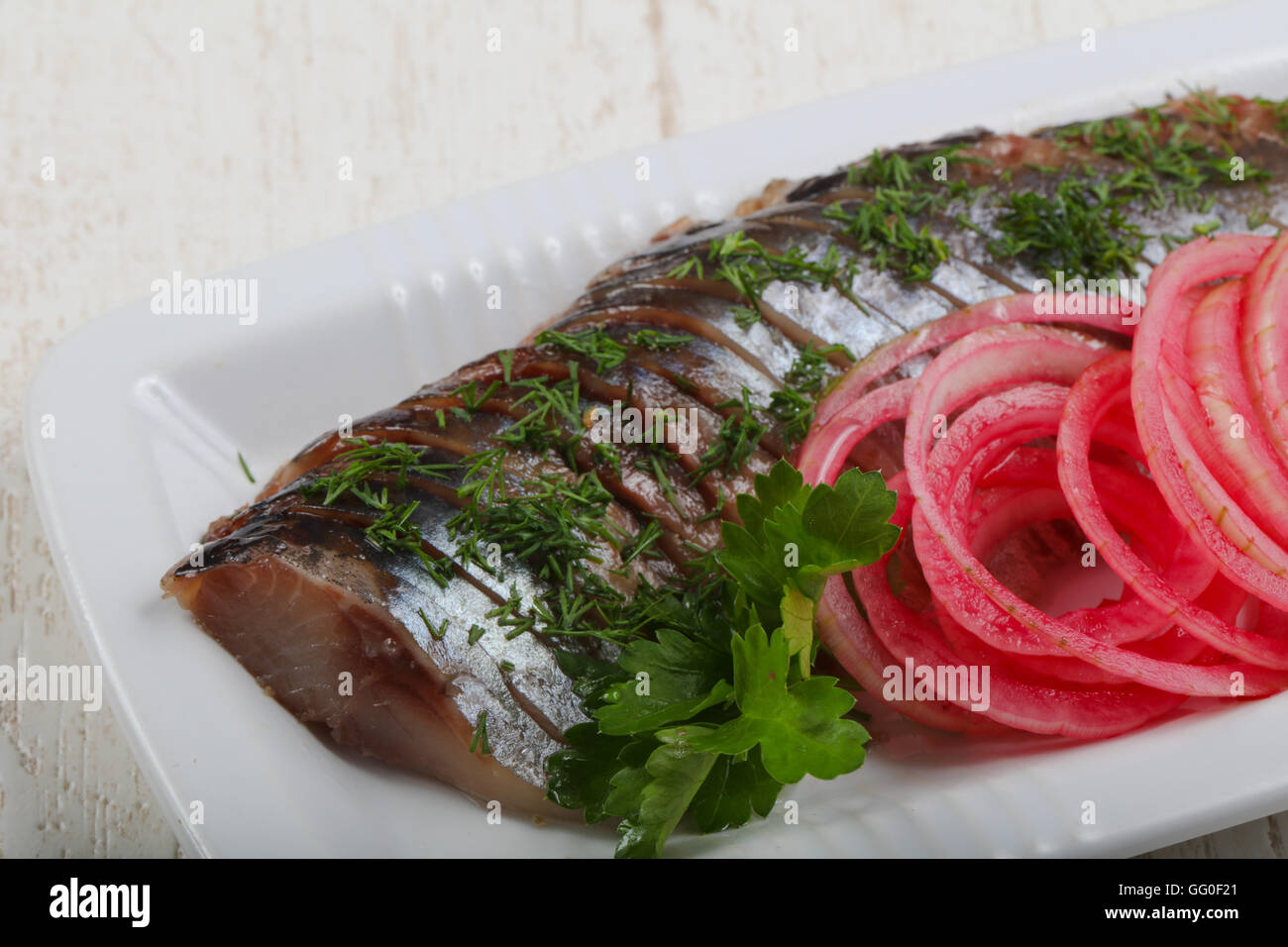Herring fillet with pickled red onion and dill Stock Photo - Alamy