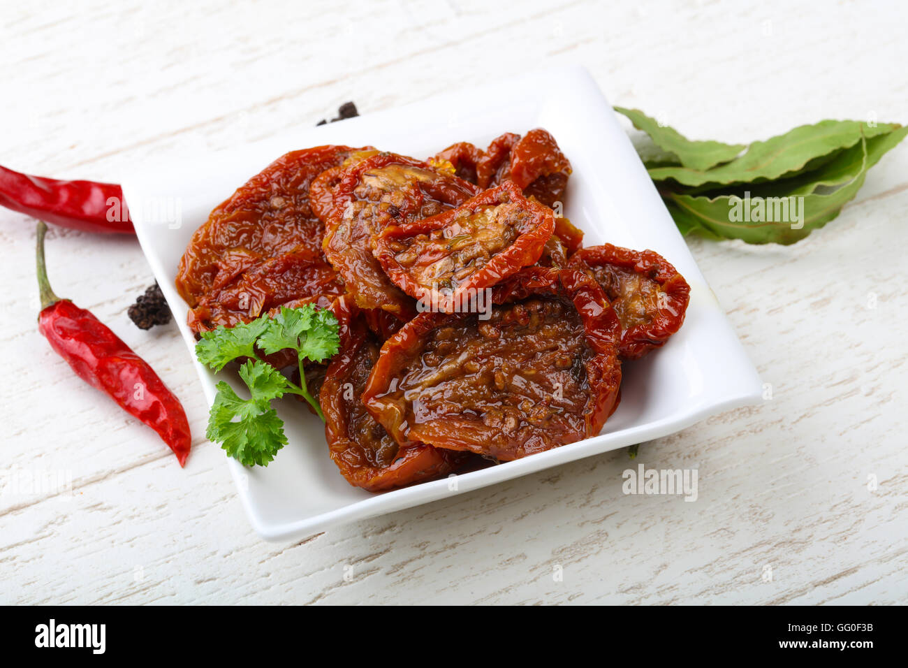 Dry tomato in olive oil with pepper Stock Photo - Alamy