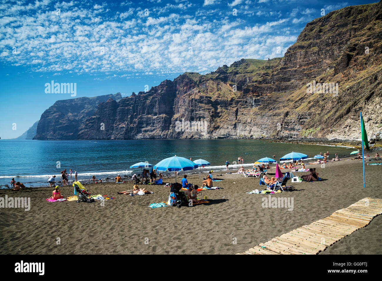 tourists at los gigantes beach landmark in south tenerife island spain ...