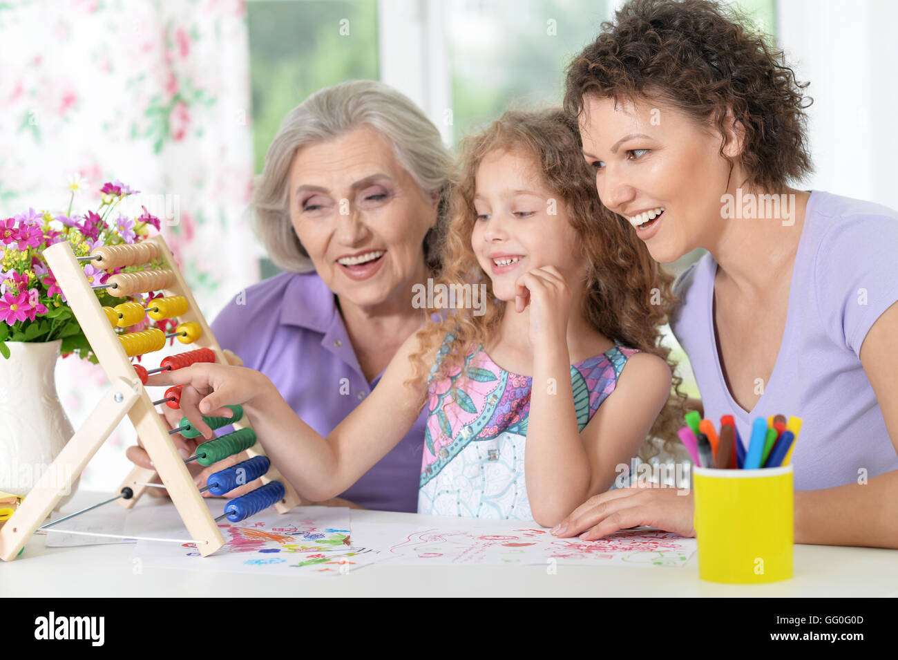happy family doing homework Stock Photo - Alamy