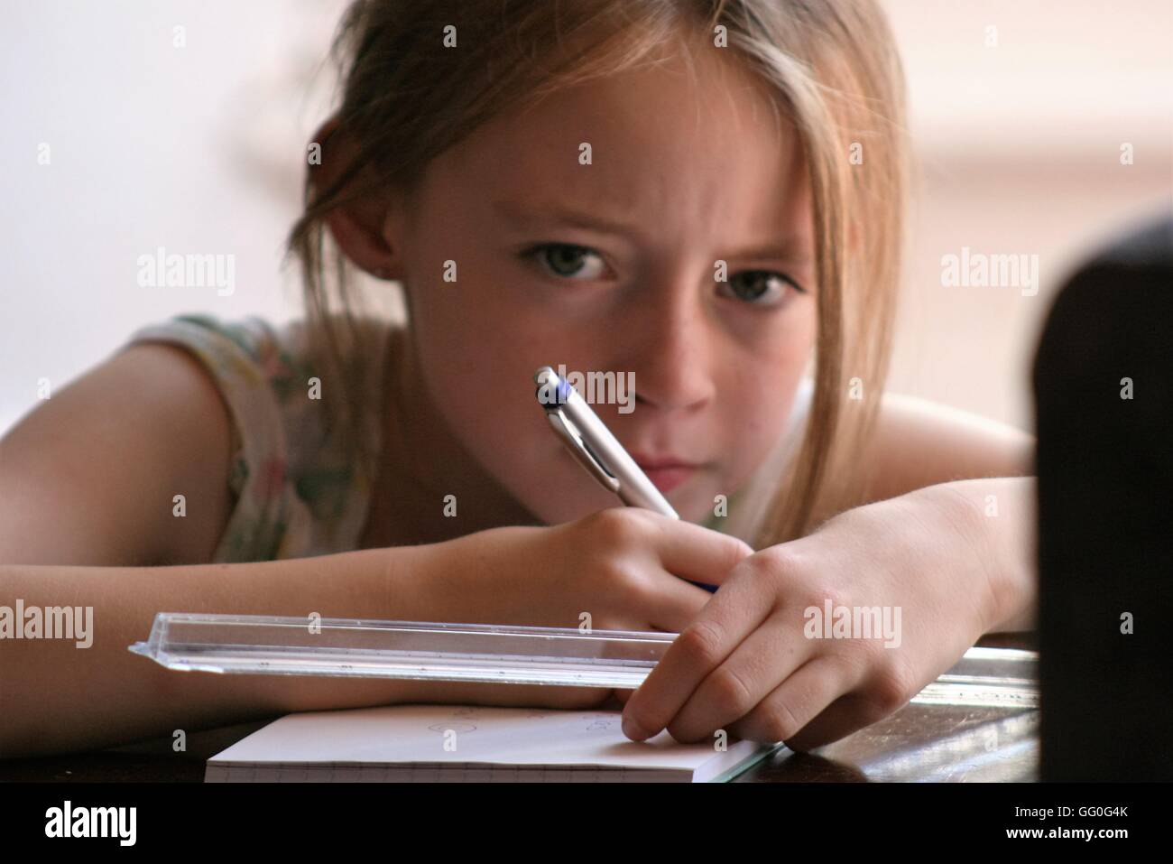 Young girl writing Stock Photo - Alamy