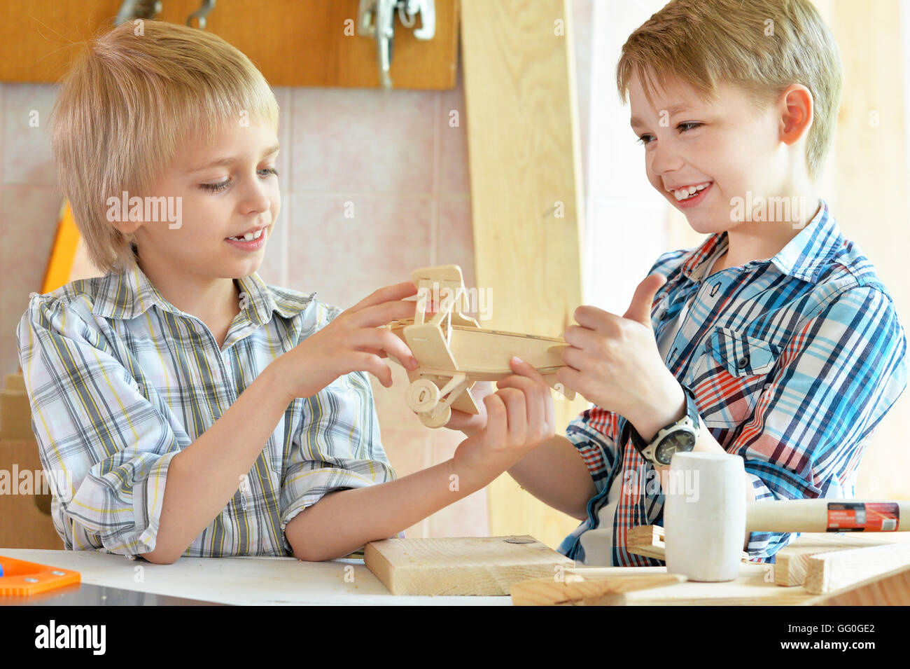 boys working with wood in workshop Stock Photo - Alamy