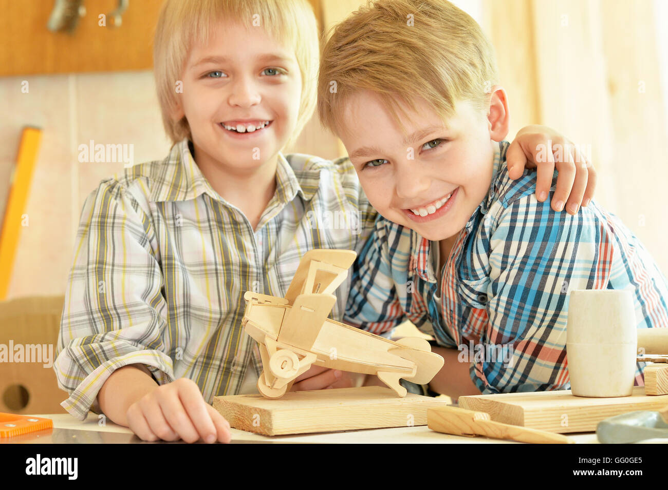 boys working with wood in workshop Stock Photo - Alamy