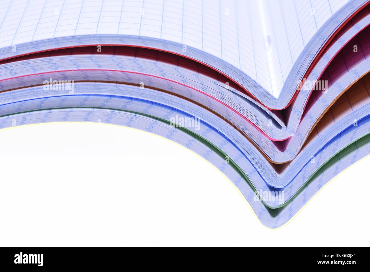 Stack of opened exercise books isolated on white background Stock Photo ...