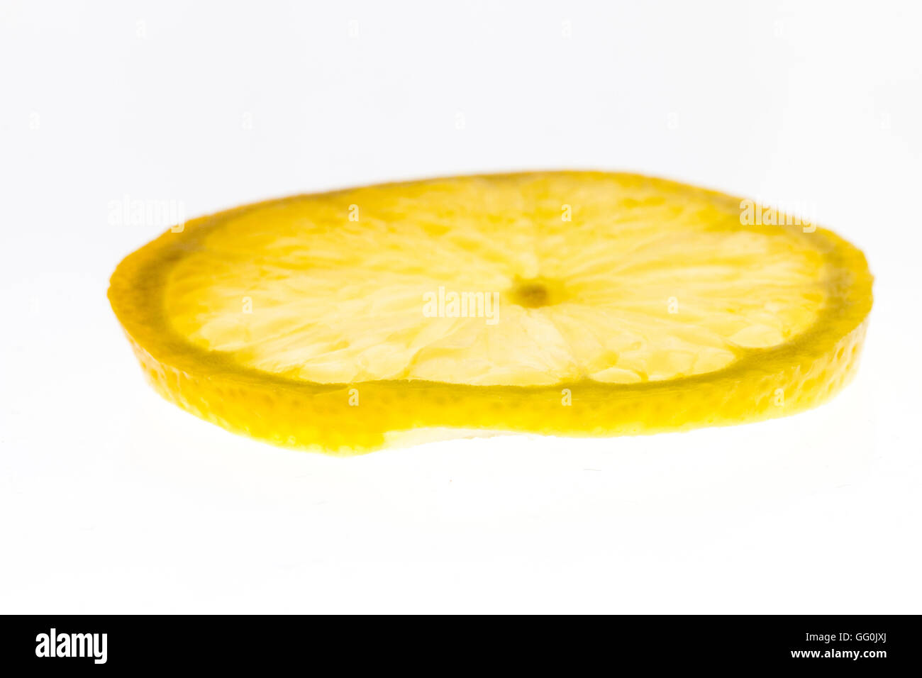 Lemon fruit. Single slice of lemon fruit on plain white background ...
