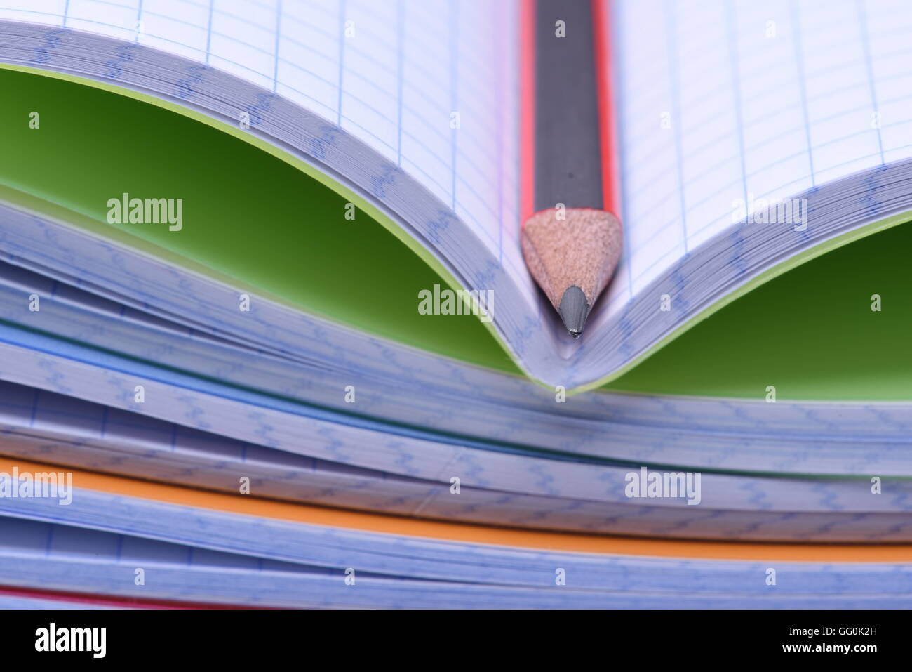 Exercise books and pencil Stock Photo - Alamy