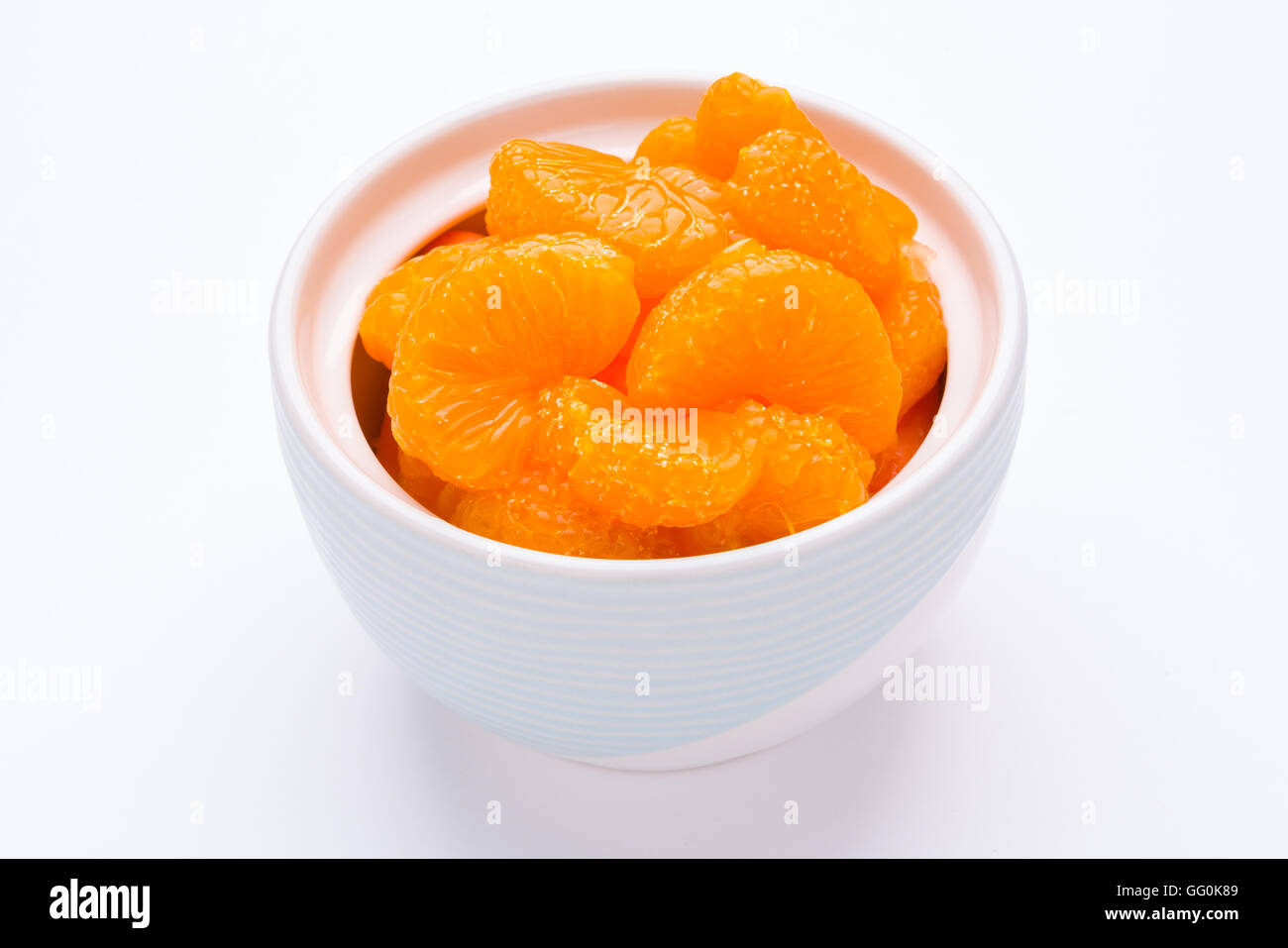 Mandarin orange segments on a white background in a bowl Stock Photo ...