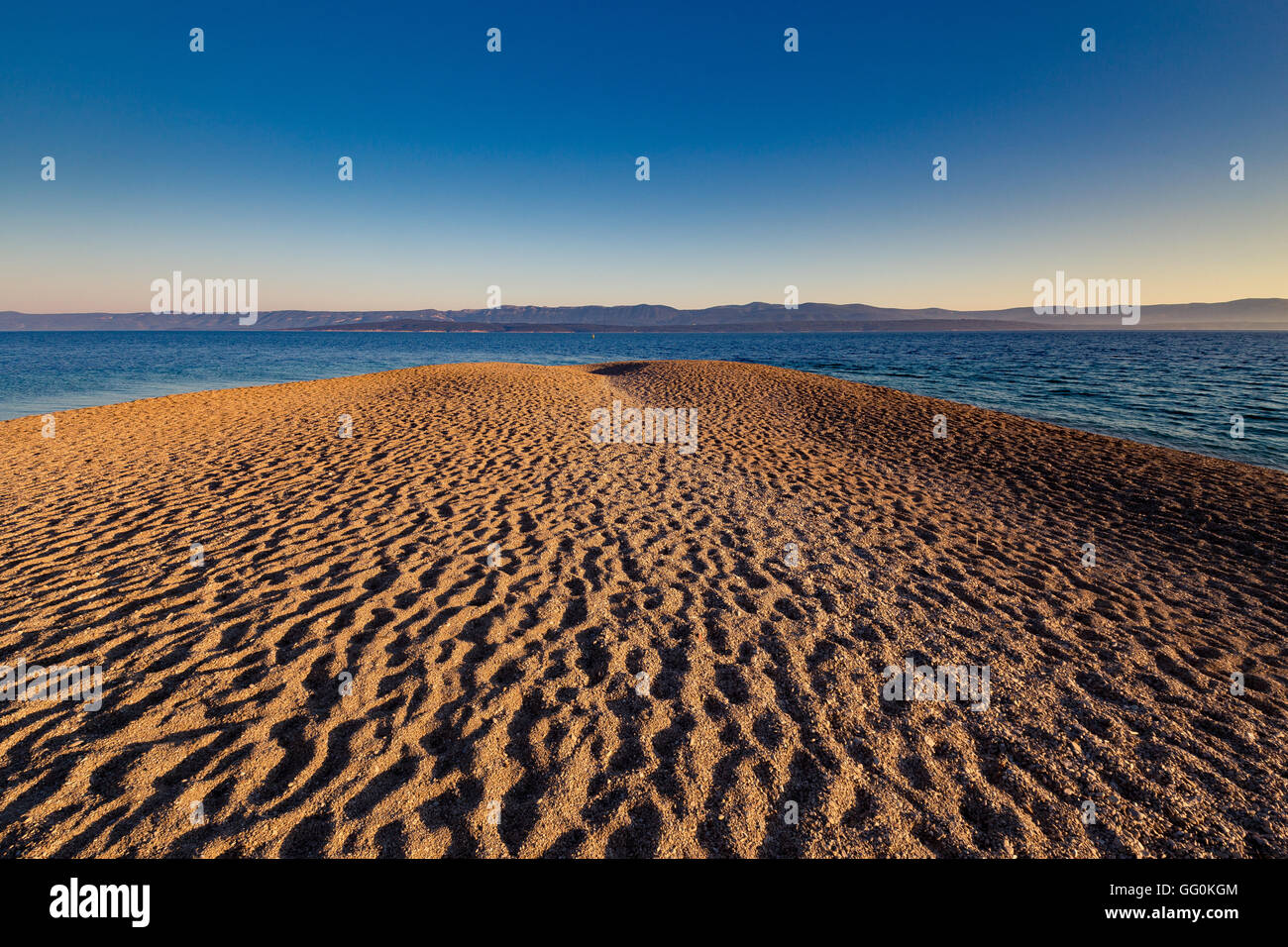 Sunset sunlight at Zlatni Rat beach. Bol, island Brac, Croatia ...